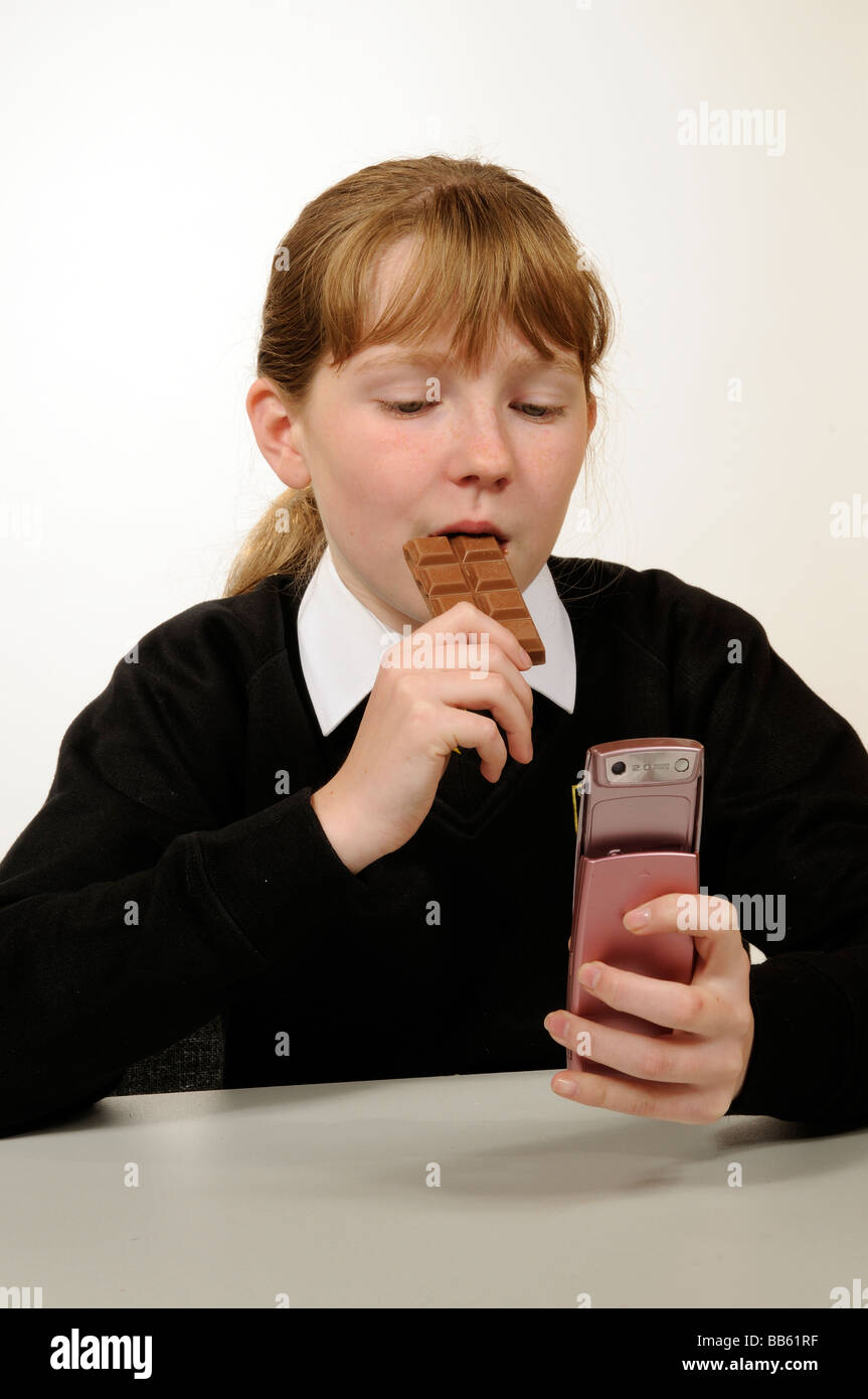 Schoolgirl child girl using cell hi-res stock photography and images ...