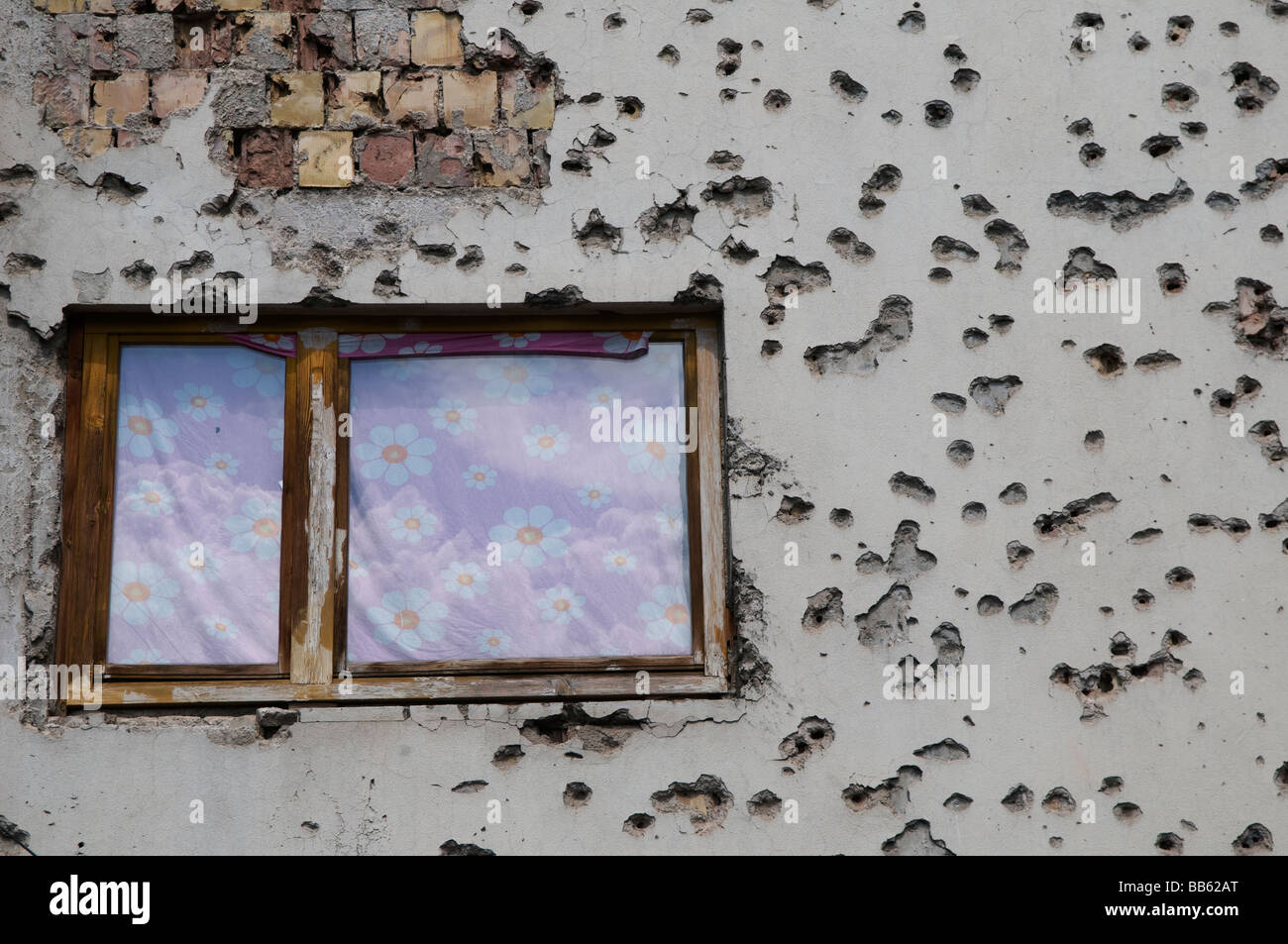 Facade of a house is riddled with bullet holes from the 1992-95 war in ...