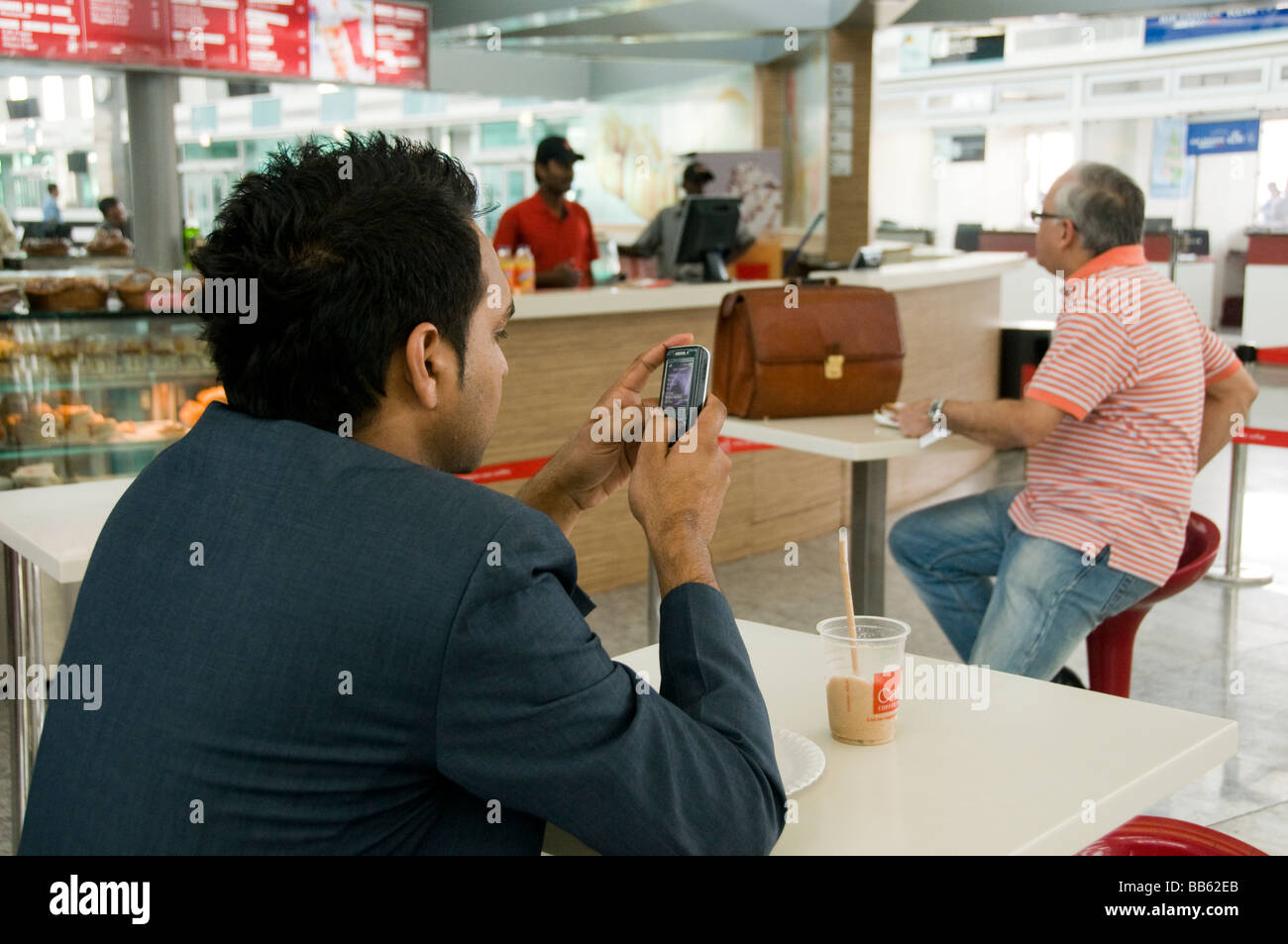 A man using a mobile phone in India Stock Photo - Alamy