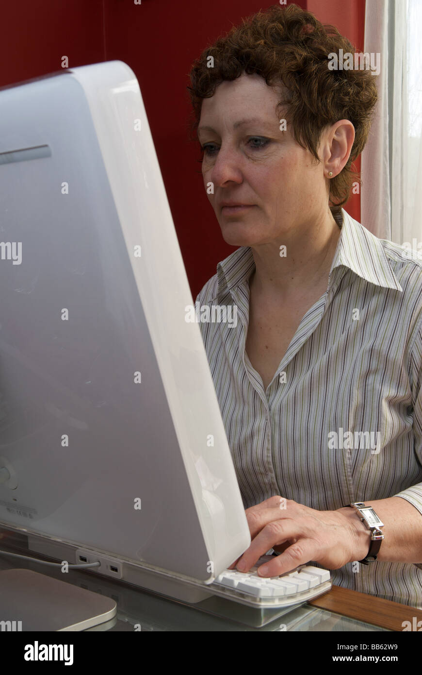 Woman working from home on a Apple Mac computer Stock Photo - Alamy