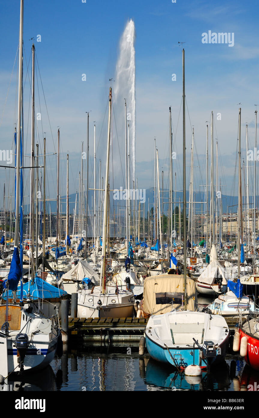 Sailing boats in the marina of Lake Geneva, water jet of the Jet d Eau ...