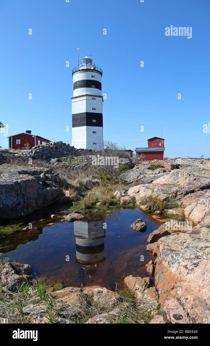 lighthouse reflected in water Stock Photo - Alamy
