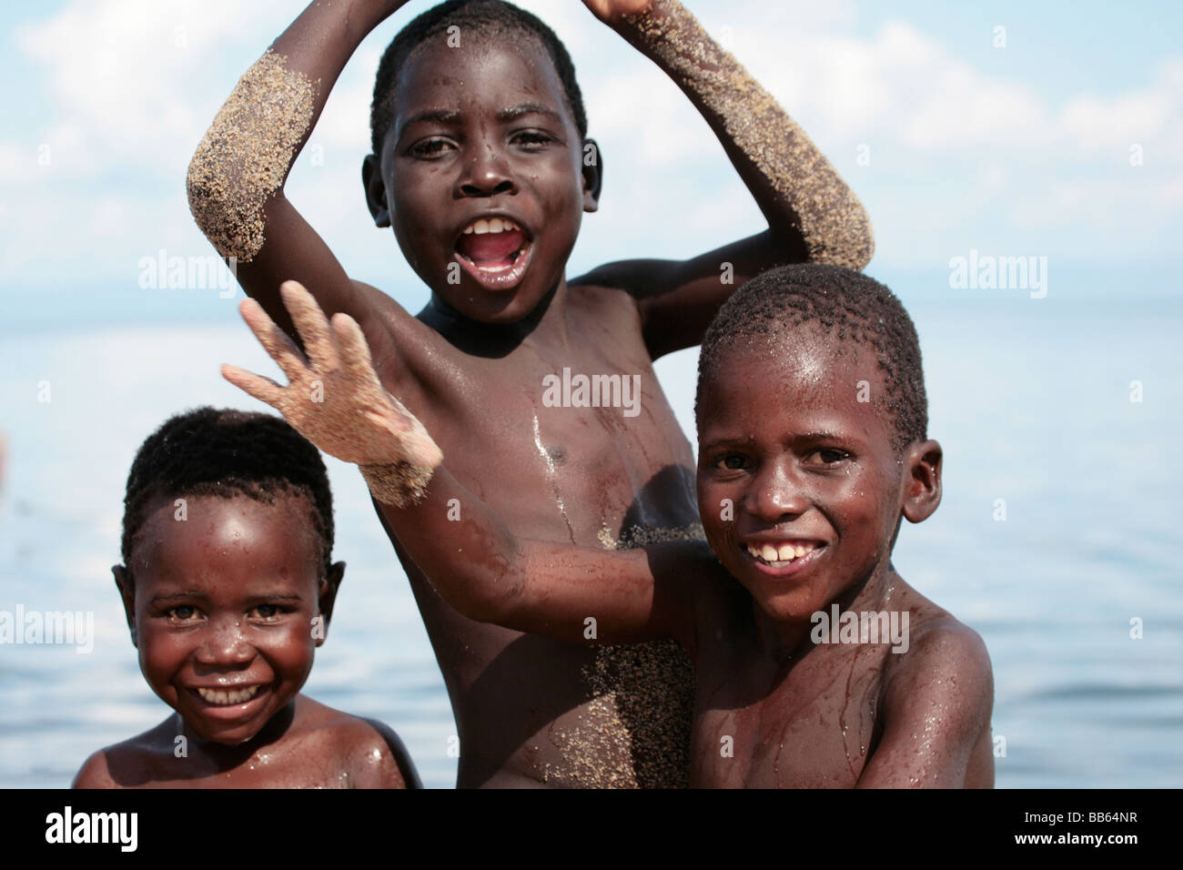 Children having fun on the shore of Lake Malawi at Monkey Bay in Malawi ...