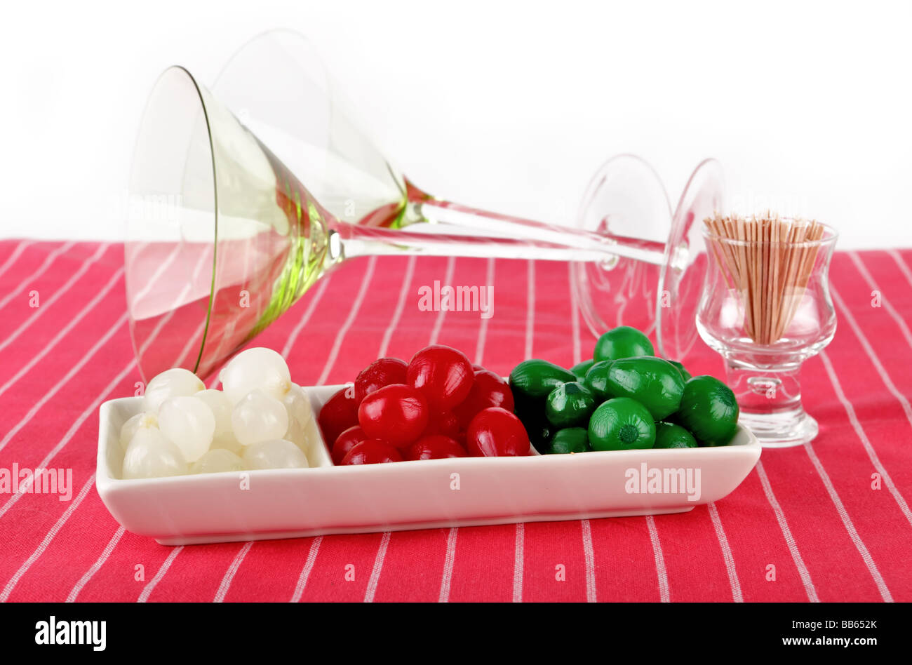 red green and white small cocktail onions on a plate ready for use ...