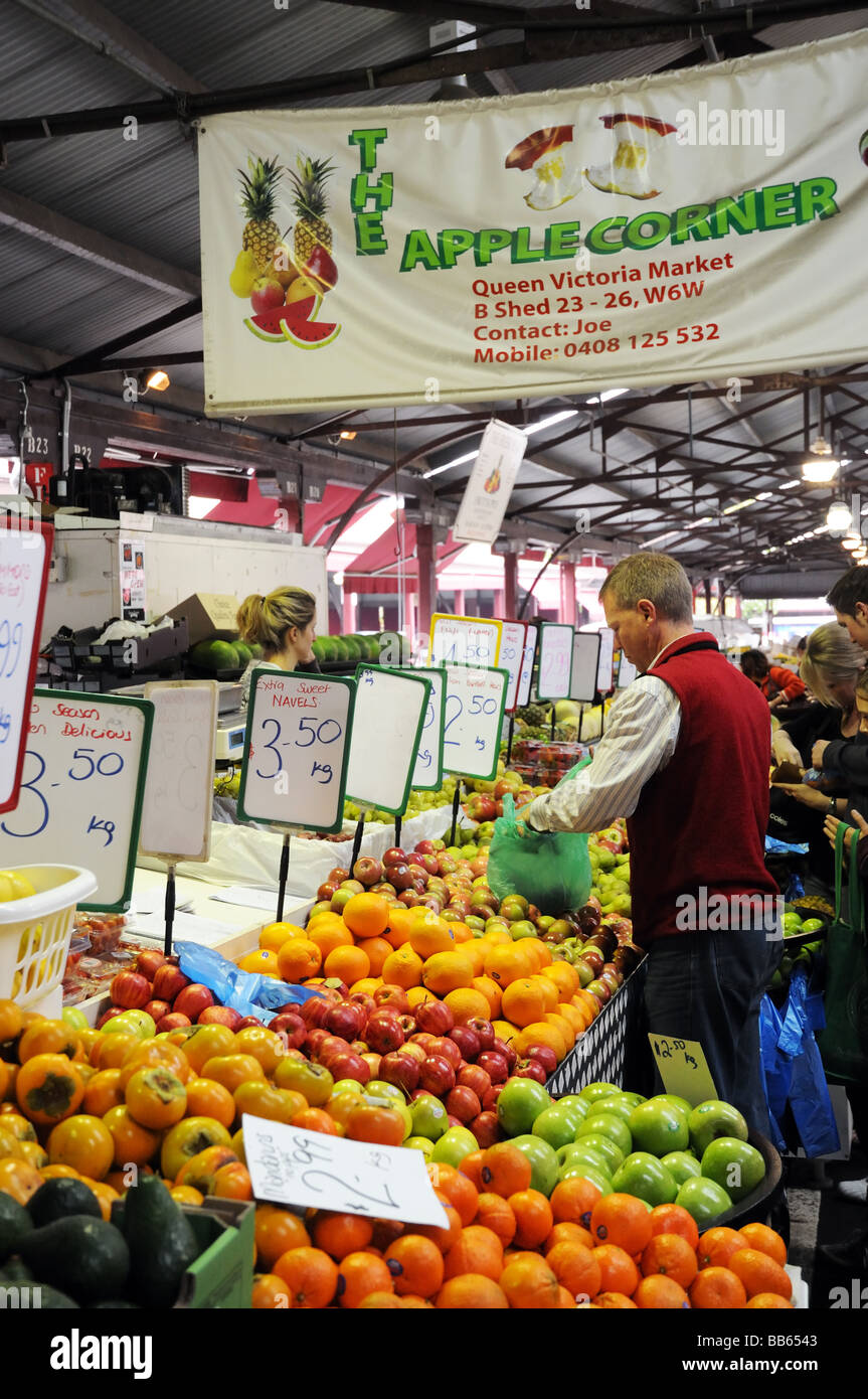 White caucasian man buying at The Apple Corner fruit and vegetable ...