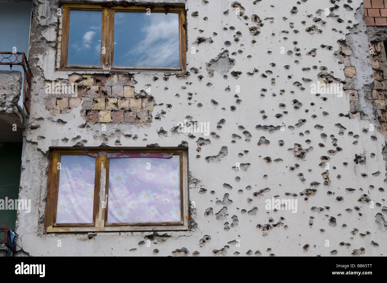 Facade of a house is riddled with bullet holes from the 1992-95 war in ...