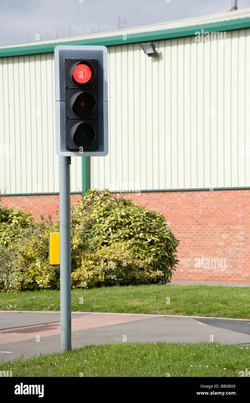 Red traffic light at a pedestrian crossing in a town in England Stock ...
