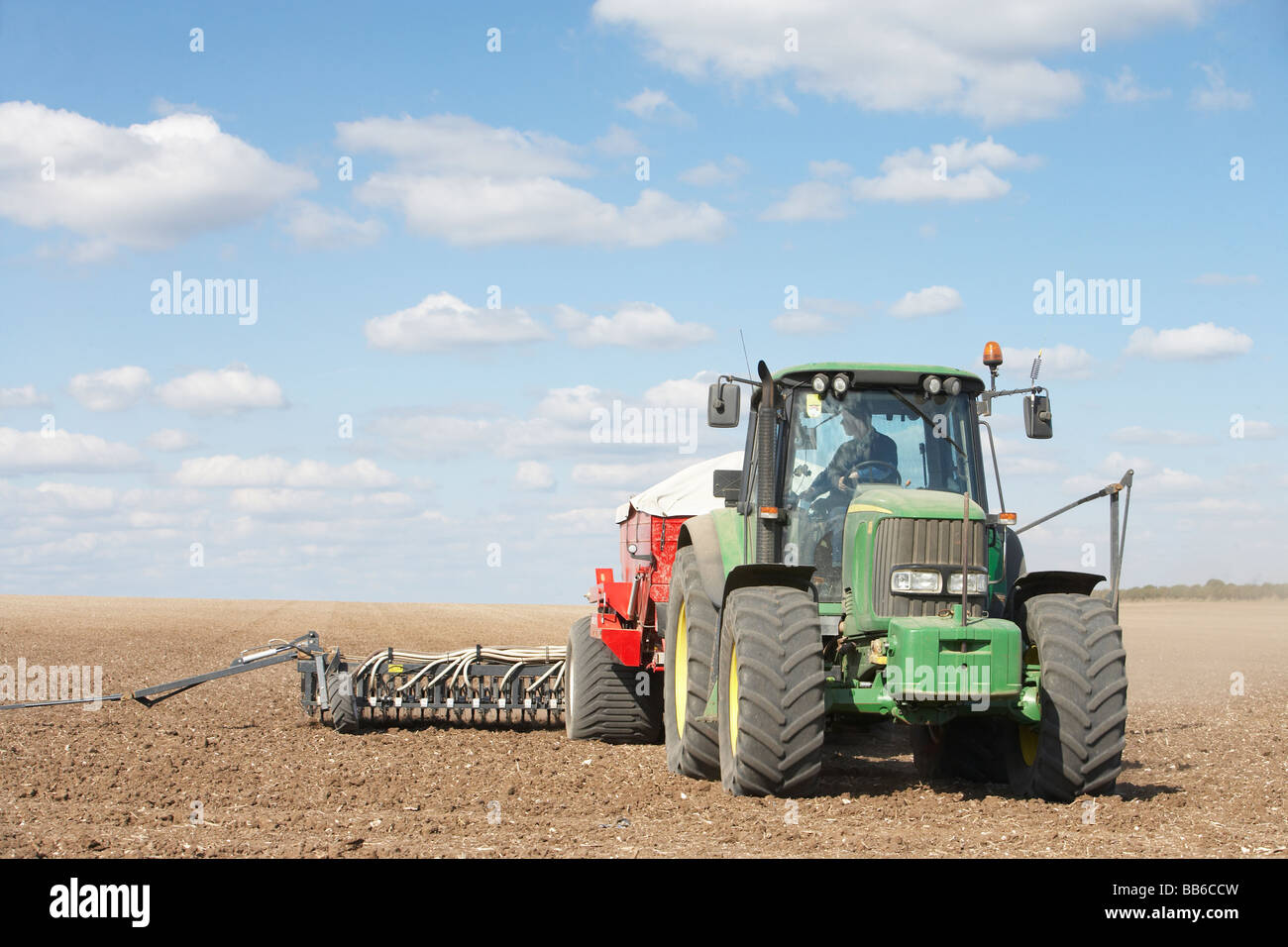 Tractor Planting Seed In Field Stock Photo - Alamy