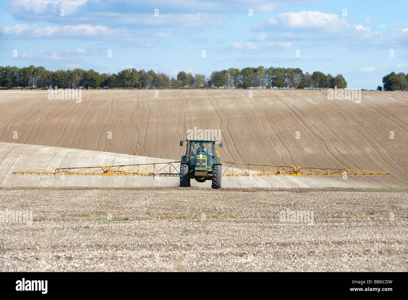 Tractor Spraying Field Stock Photo - Alamy