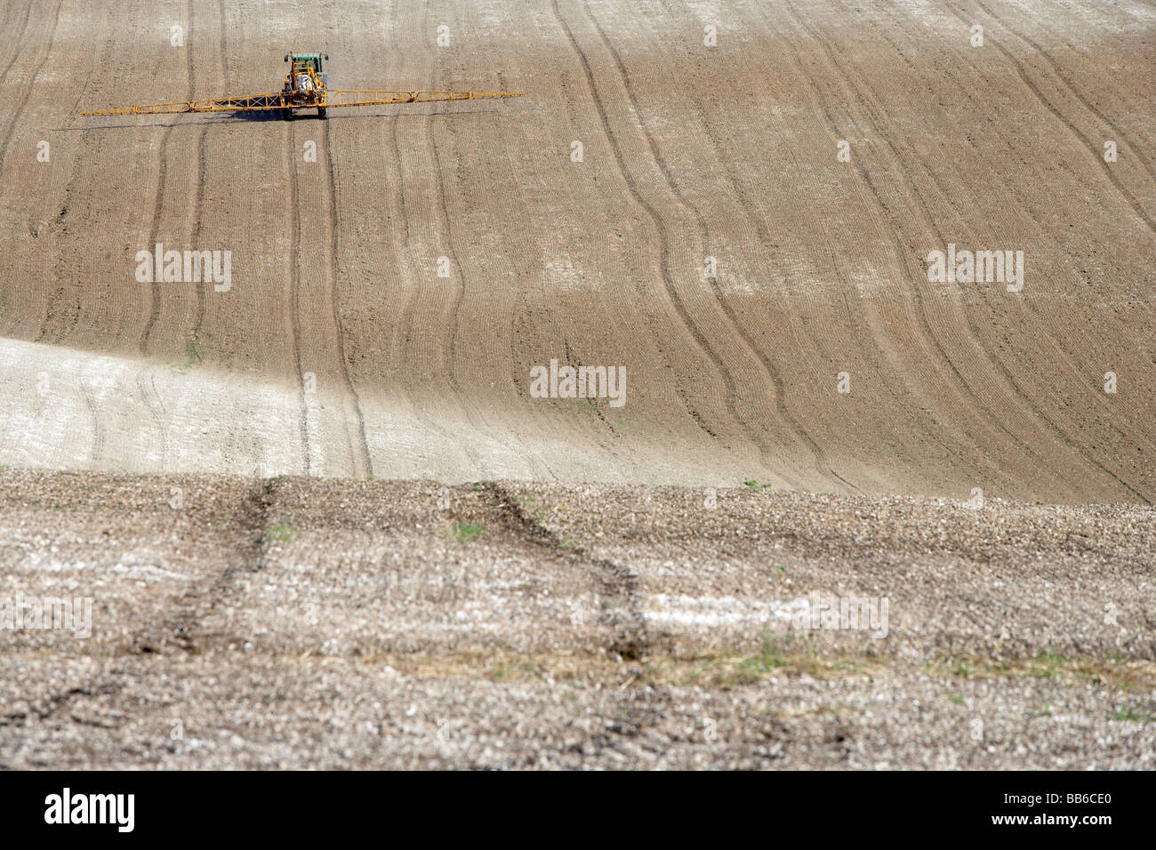Tractor Spraying Field Stock Photo - Alamy