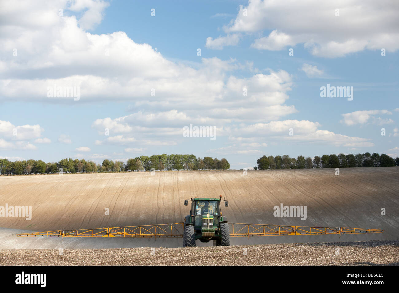 Tractor Spraying Field Stock Photo - Alamy