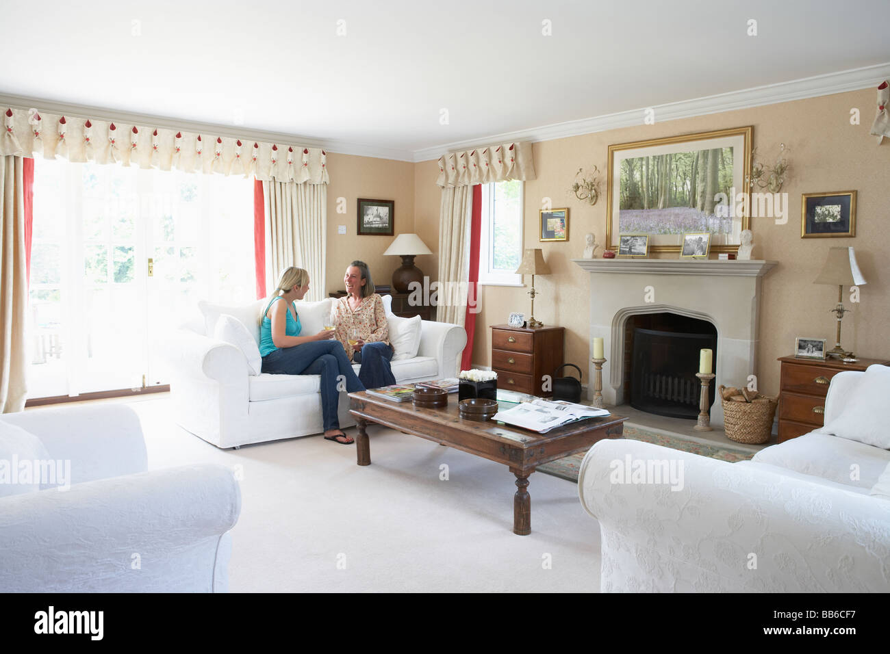 Two Women Relaxing In Lounge Stock Photo - Alamy