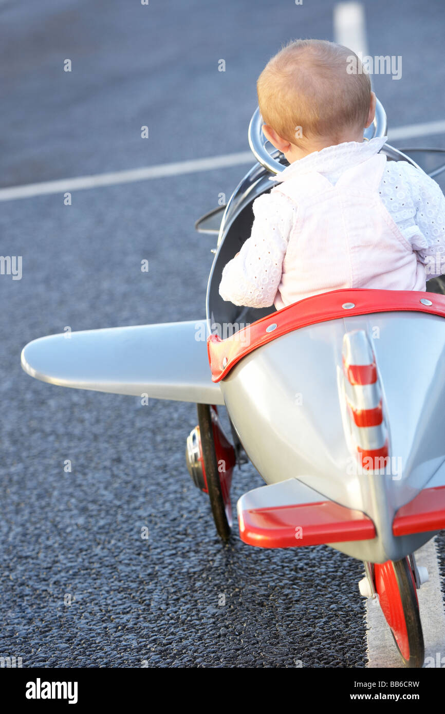 Baby Girl Riding In Toy Aeroplane Stock Photo - Alamy