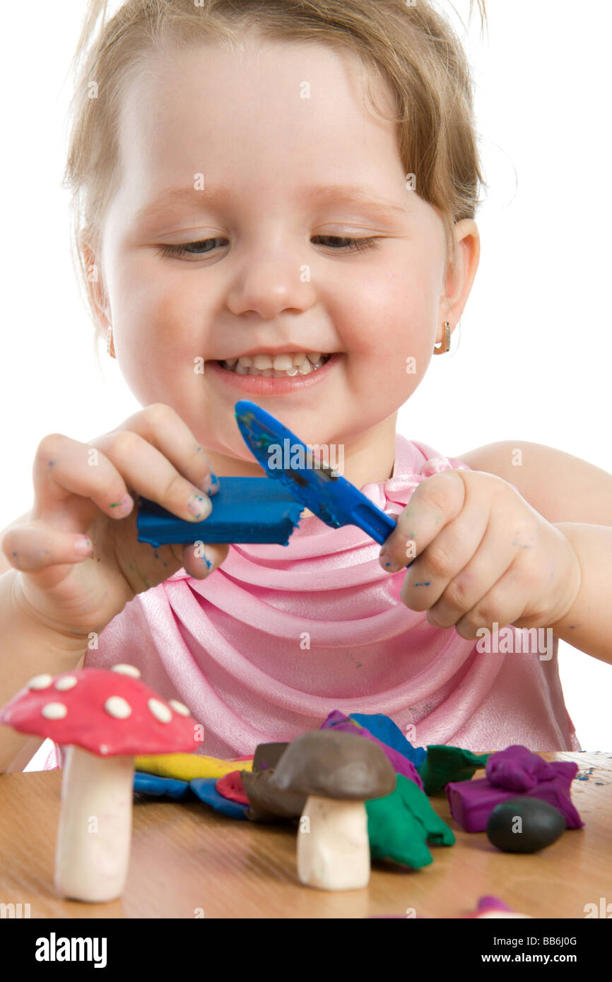 Cute baby girl playing with color play plasticine Stock Photo - Alamy
