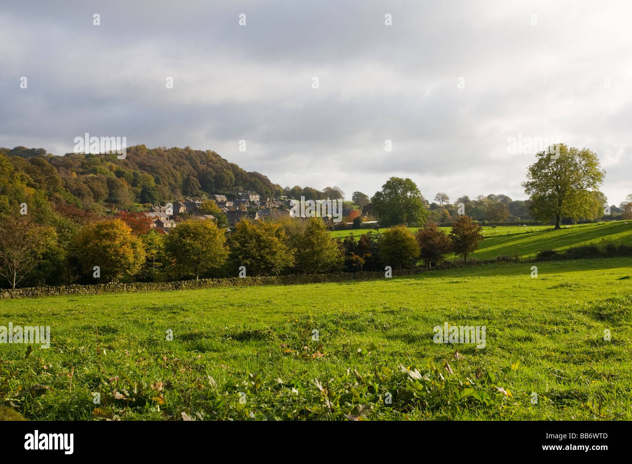 View looking across farmland towards the village of Birchover in the ...