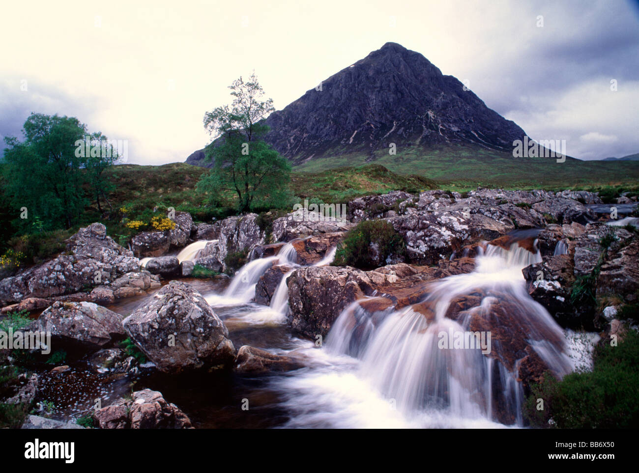 Stream flowing from mountain in Glencoe Scotland Stock Photo - Alamy