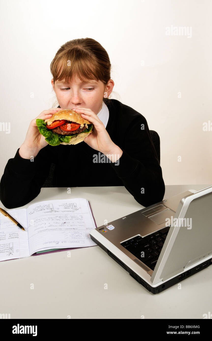 Girl homework eat desk hi-res stock photography and images - Alamy