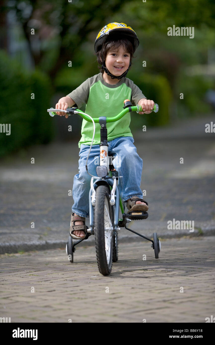 Little boy riding a bike Stock Photo - Alamy