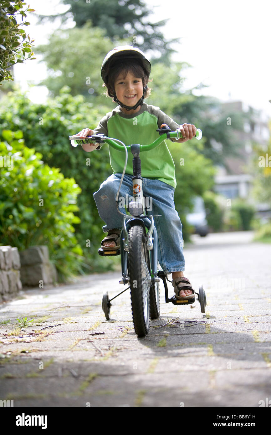 Little boy riding a bike Stock Photo - Alamy