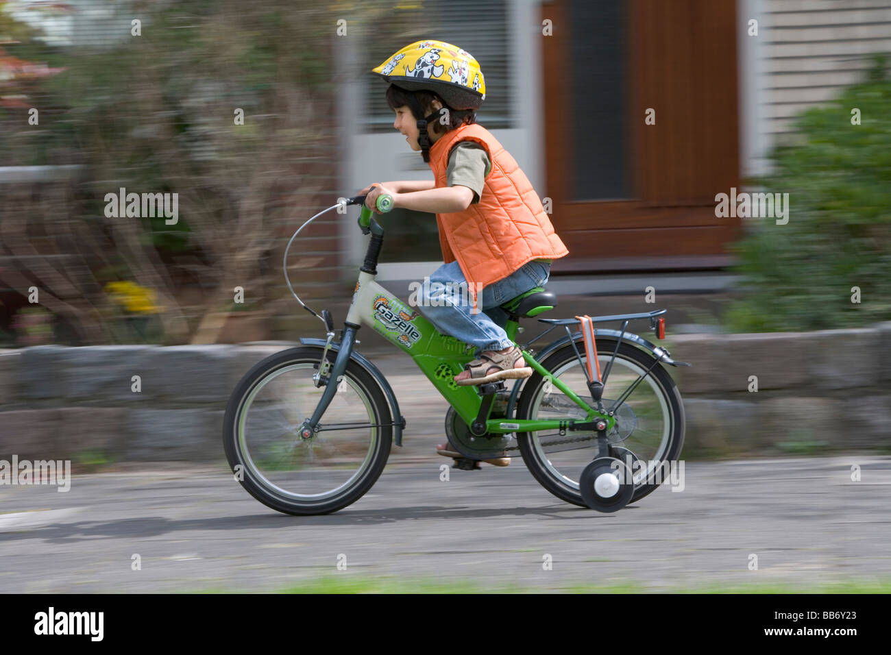 Little boy riding a bike Stock Photo - Alamy