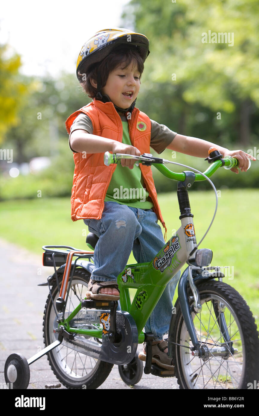 Little boy riding a bike Stock Photo - Alamy