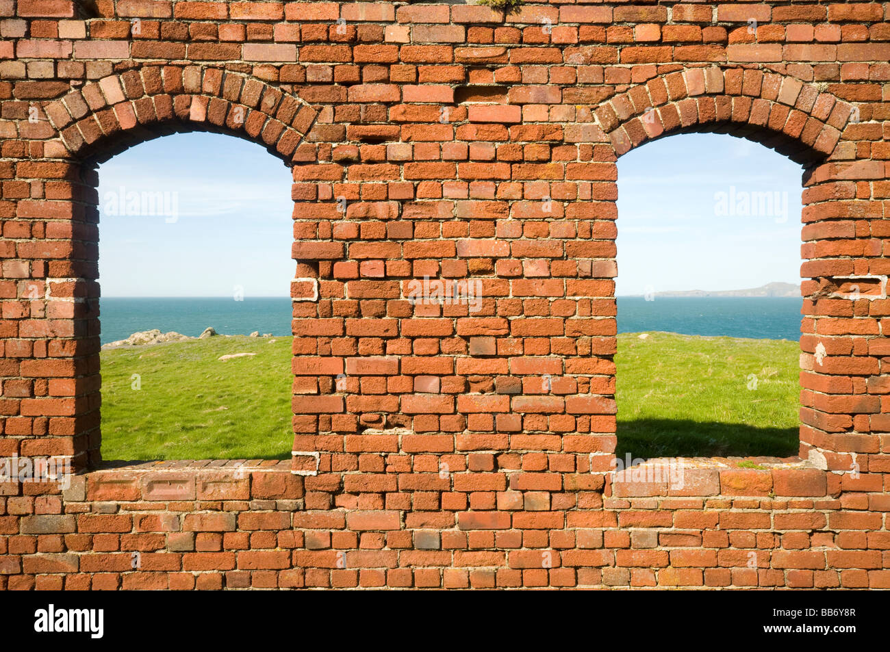 Falling down brick building at Porthgain Pembrokshire over looking sea ...