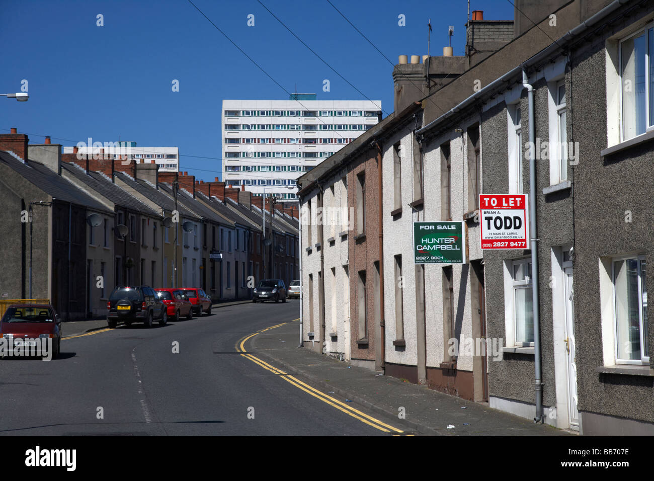 terraced houses and high rise inver flats housing on the glynn road in ...