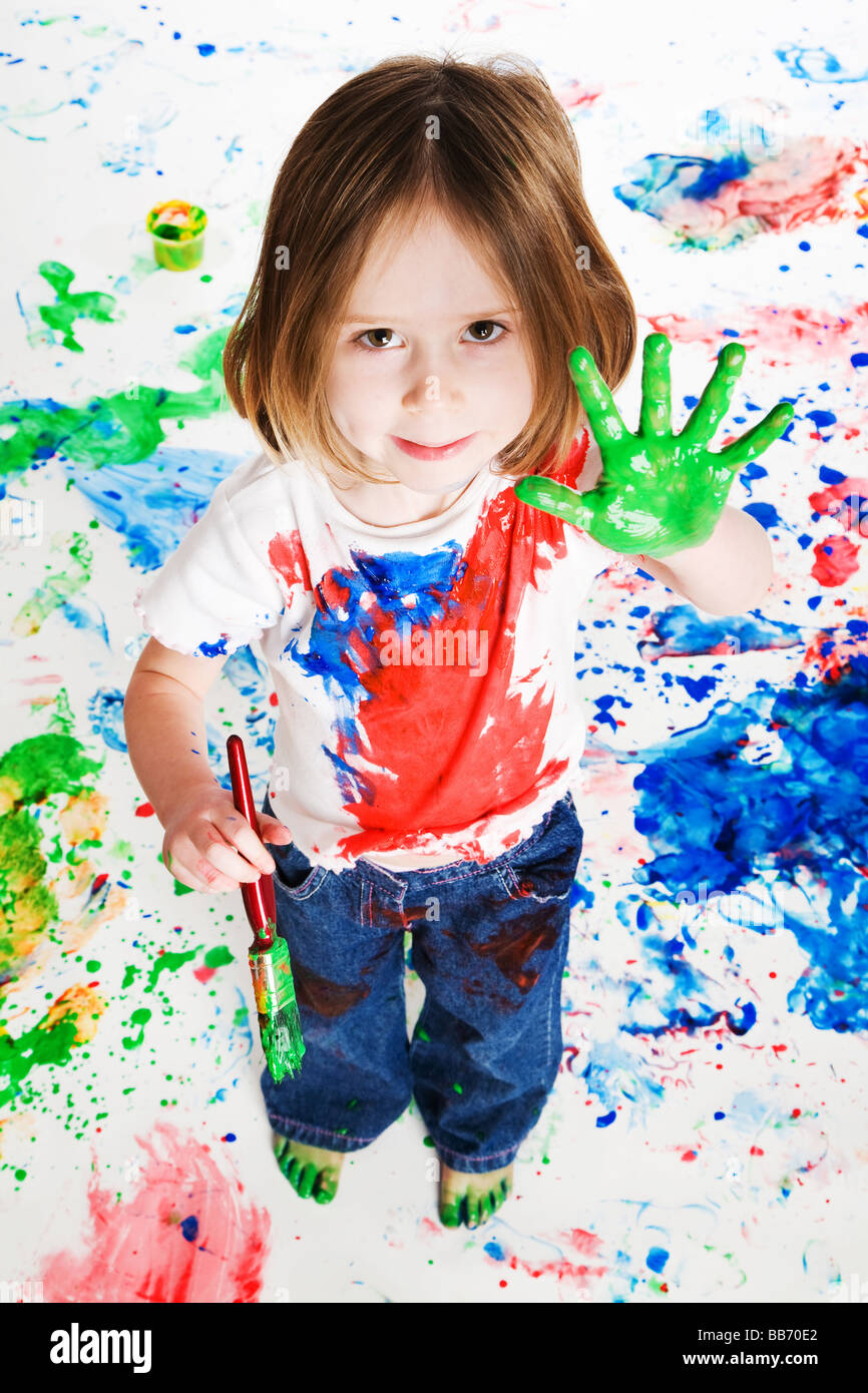Preschool child holding her painted hand to the camera Stock Photo - Alamy