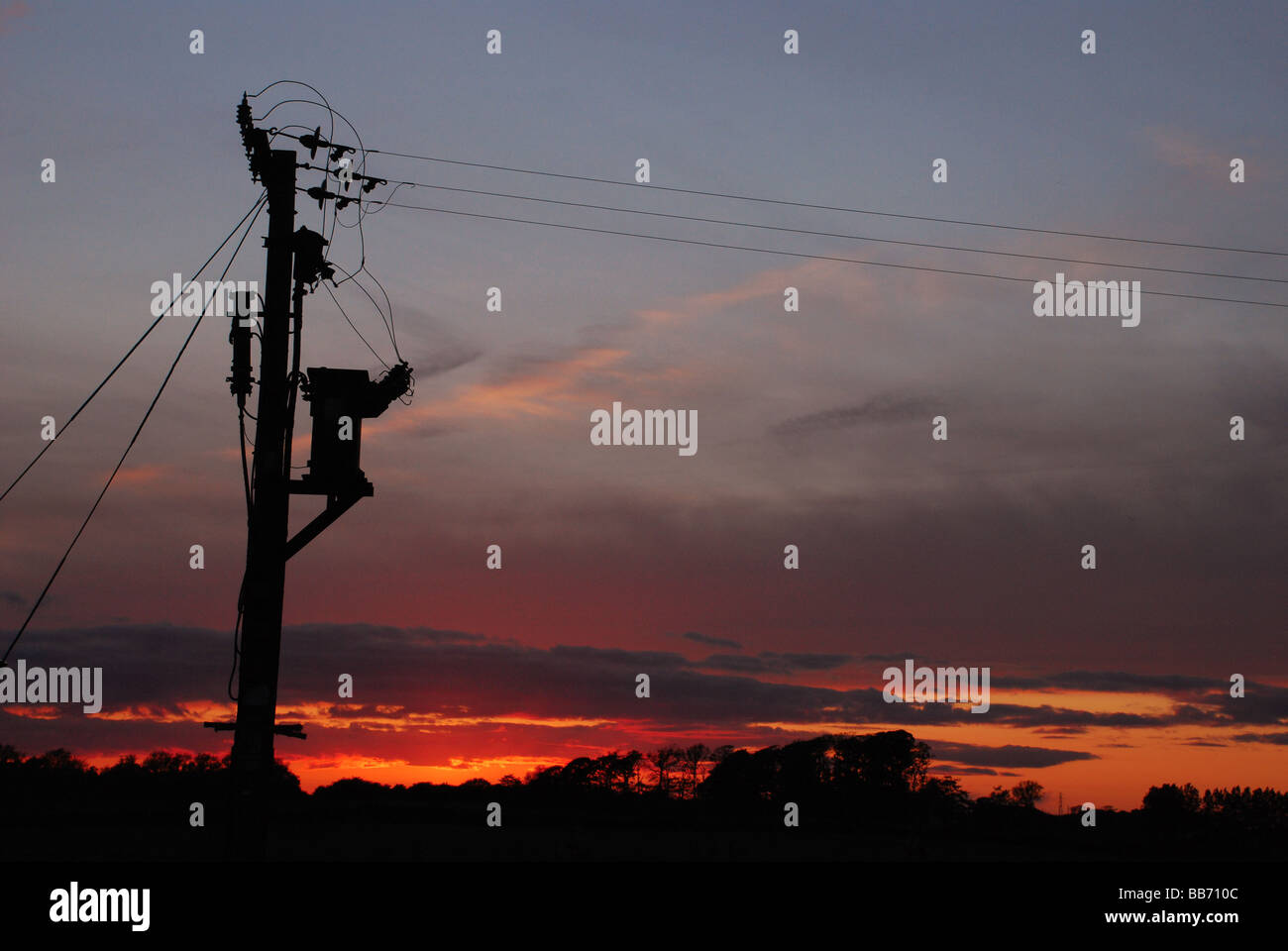Power lines at sunset Stock Photo - Alamy