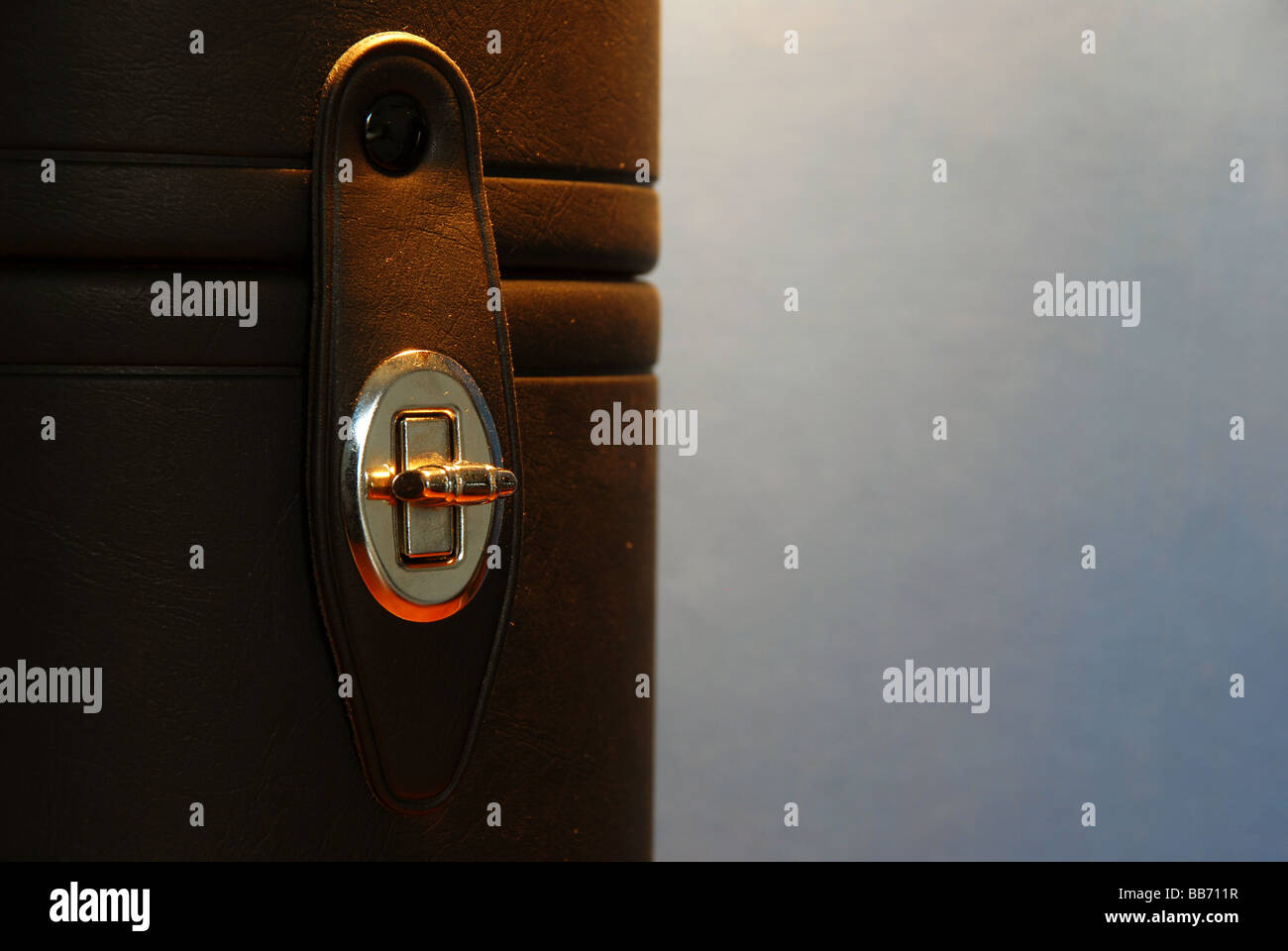 Case with latch against soft blue background Stock Photo - Alamy