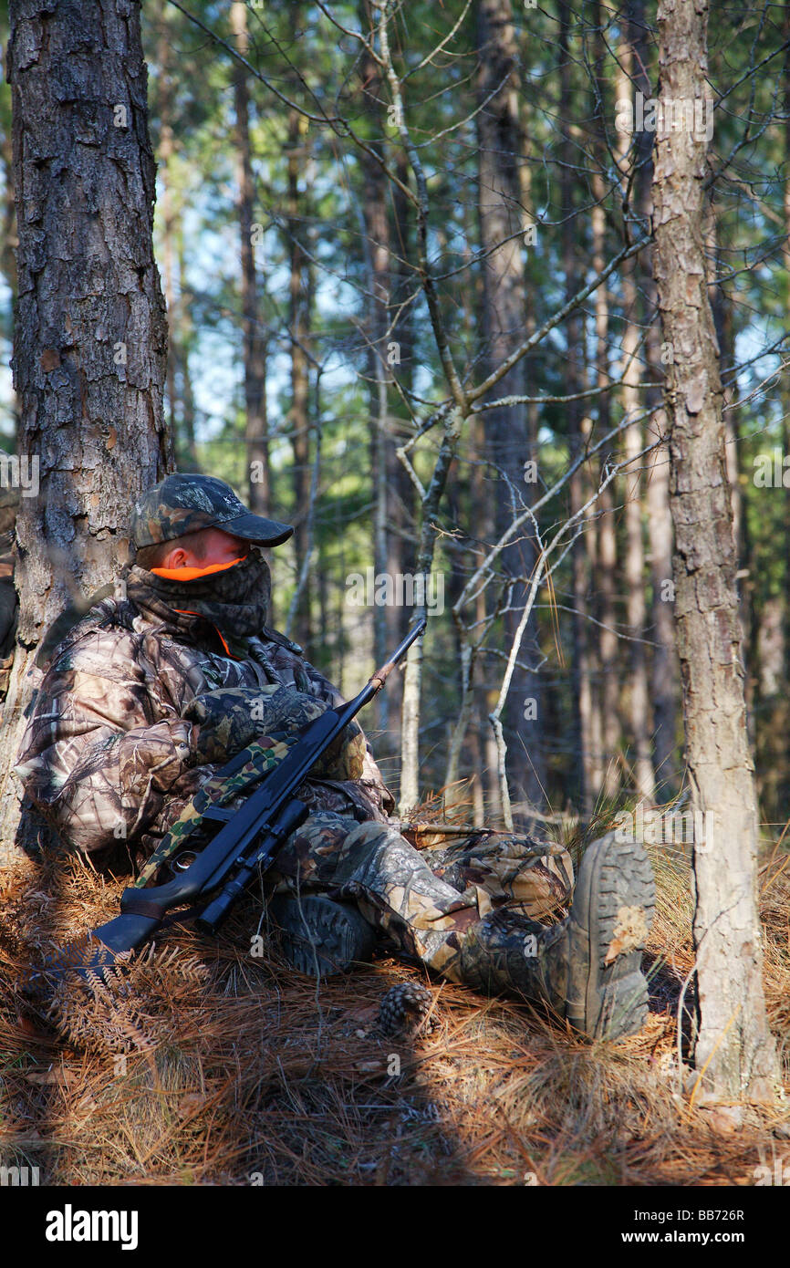 Hunter resting against tree looking hi-res stock photography and images ...