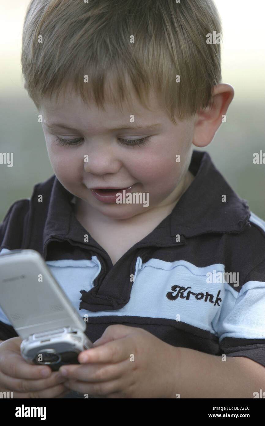 Boy with a mobile telephone Stock Photo - Alamy