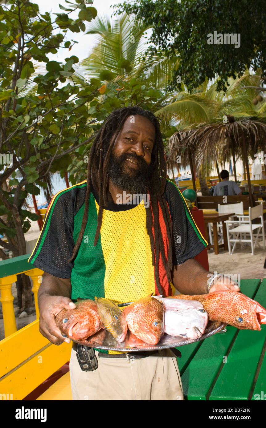 Kali owner of Kali's Beach Bar with tray of fish St Martin st Maarten ...