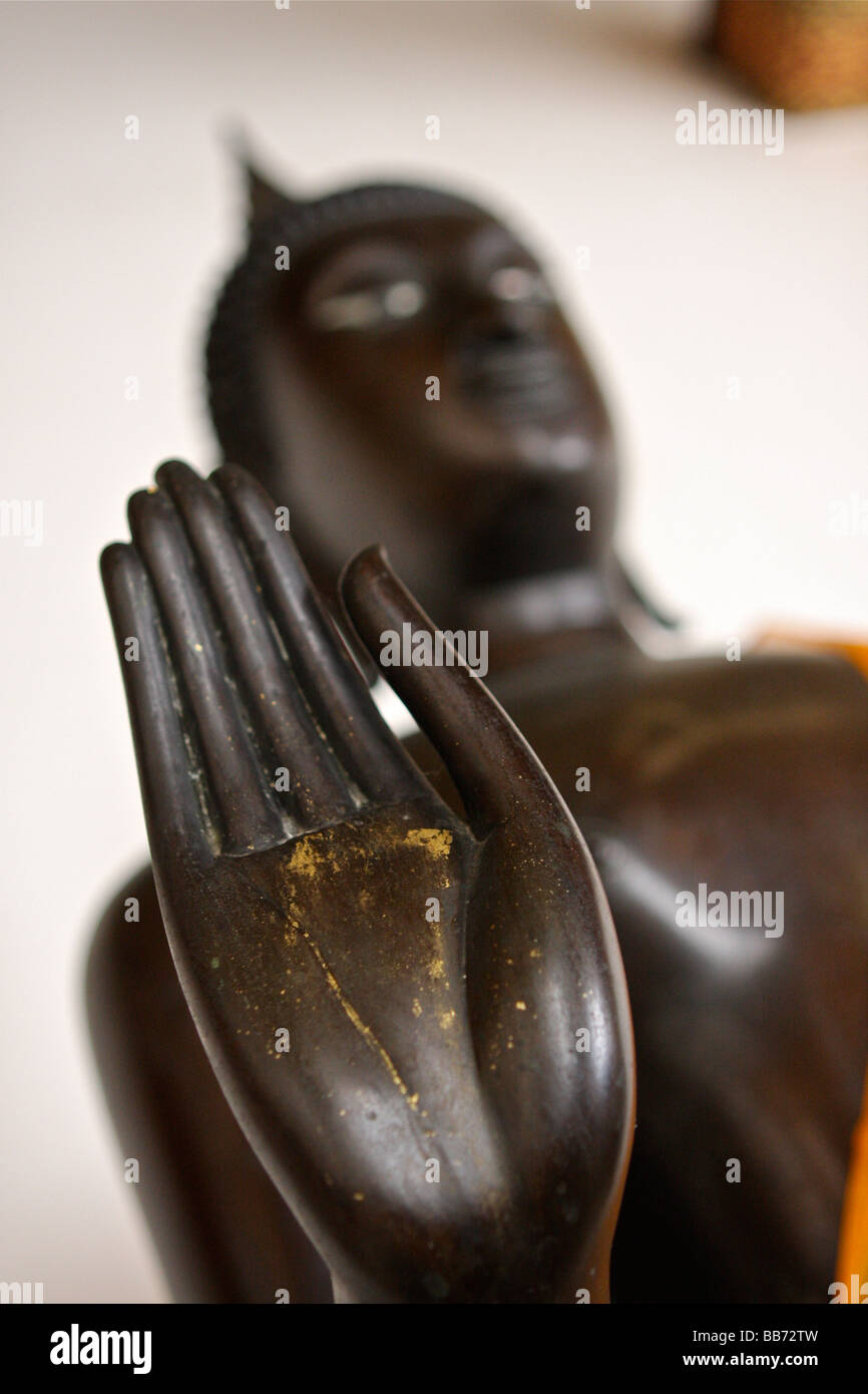 black bouddha hand statue Stock Photo - Alamy