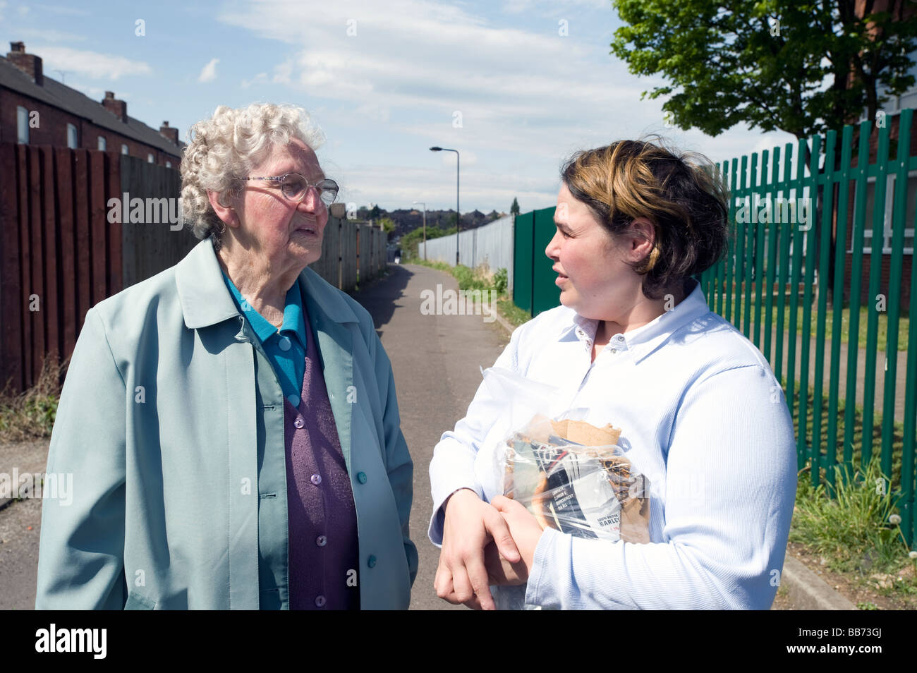 Two friends talking Stock Photo - Alamy