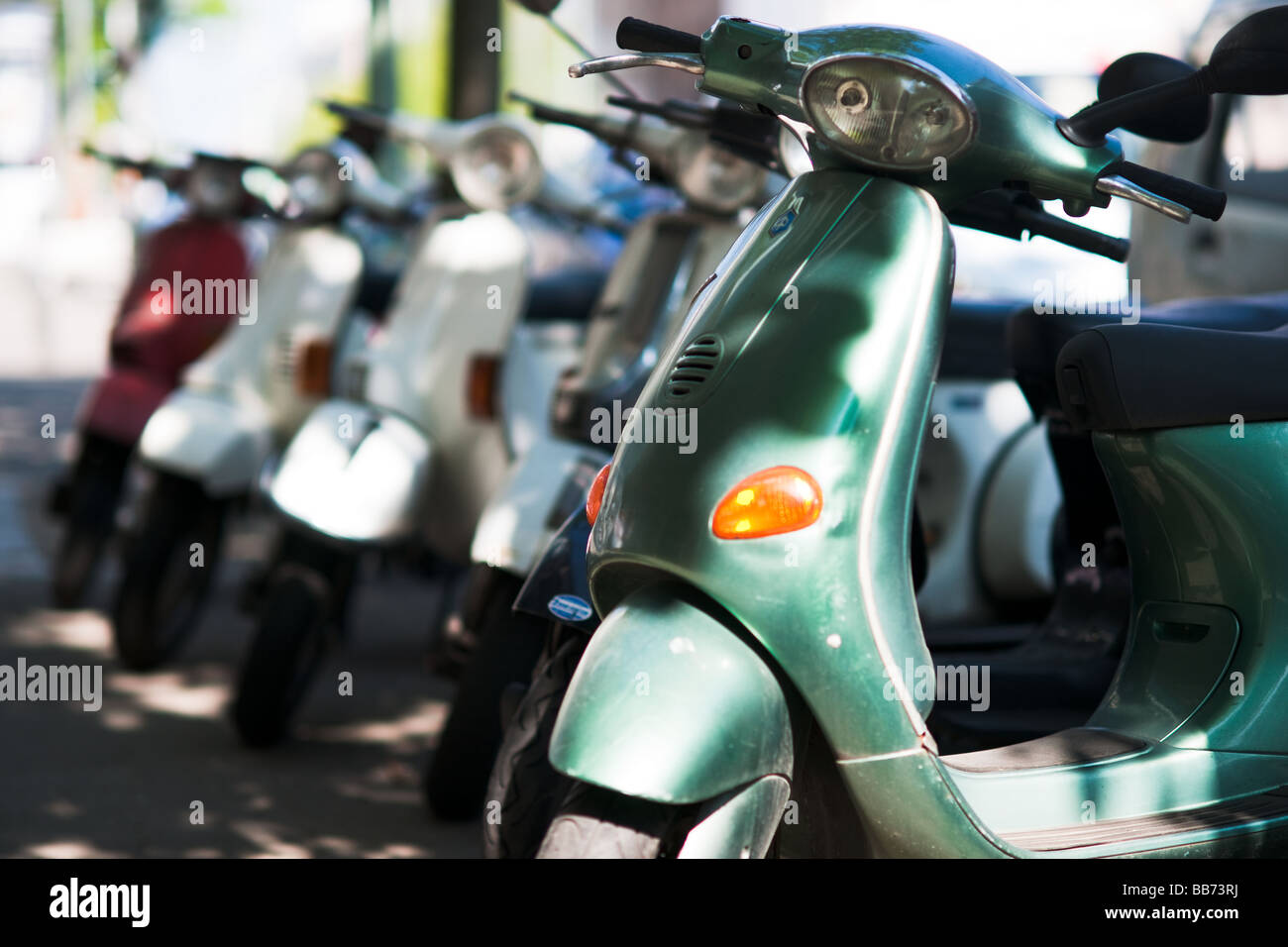 A line of parked mopeds Stock Photo - Alamy