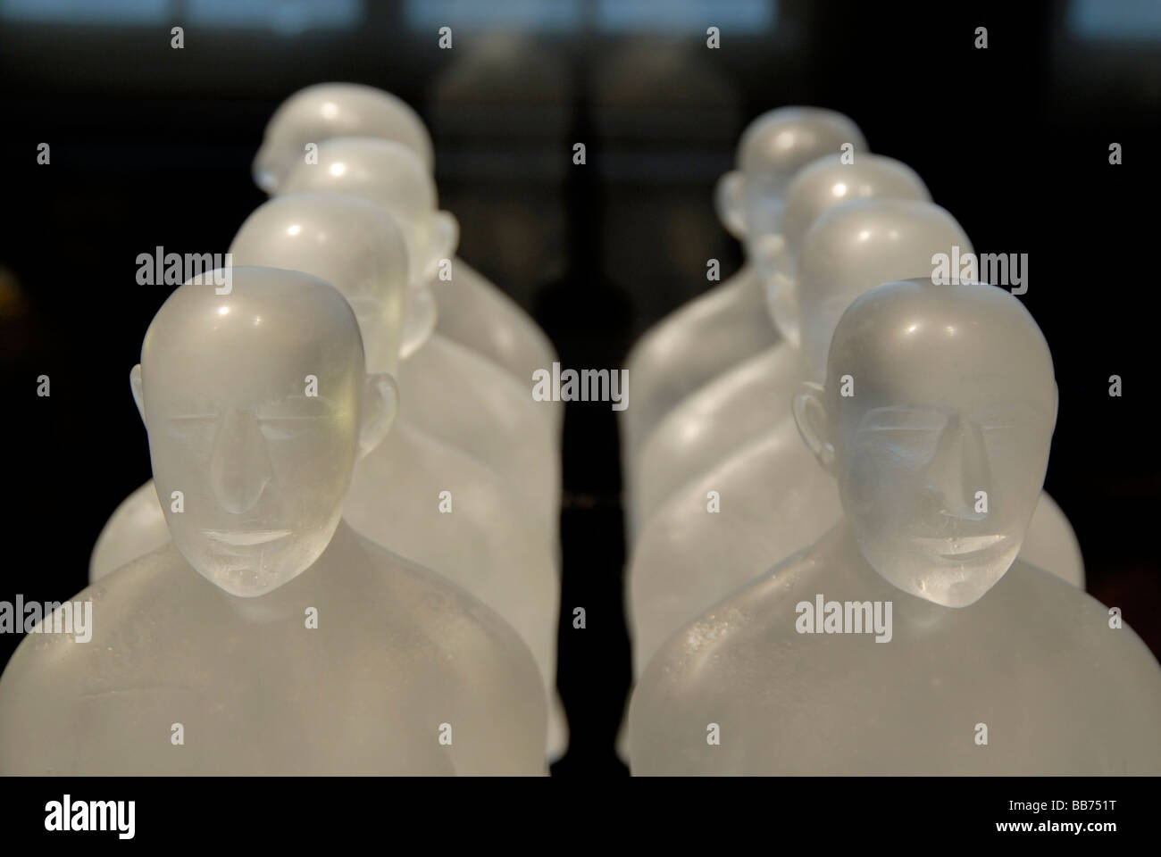 Two rows of glass heads Stock Photo - Alamy