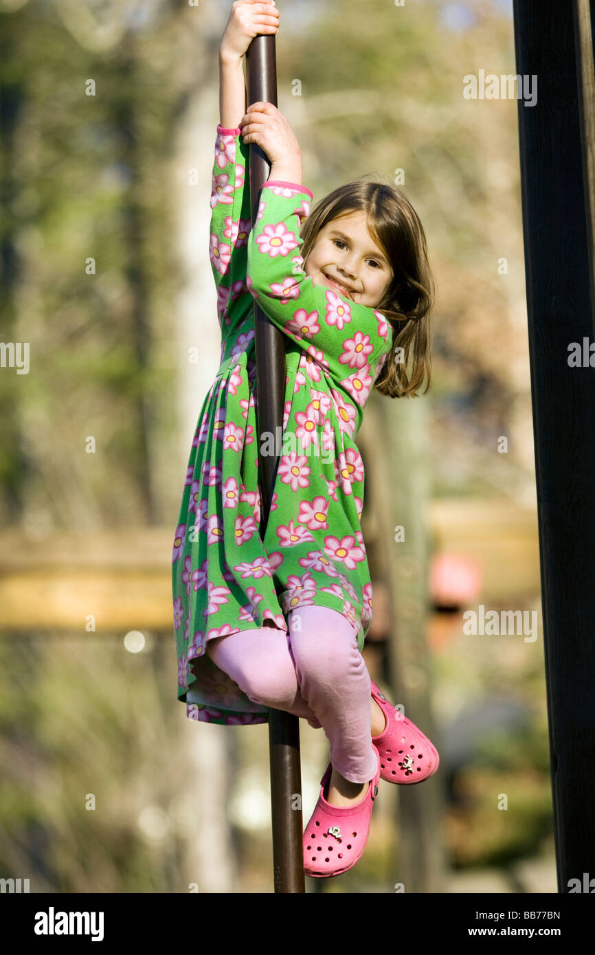 Young girl sliding on pole at playground - Franklin Park - Brevard ...