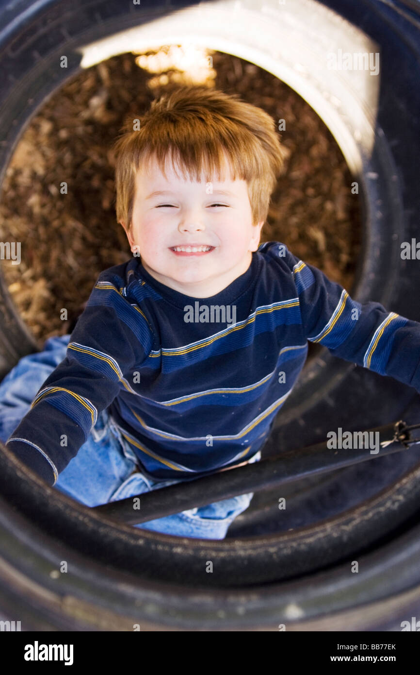 Child looking through tire at playground - Franklin Park - Brevard ...