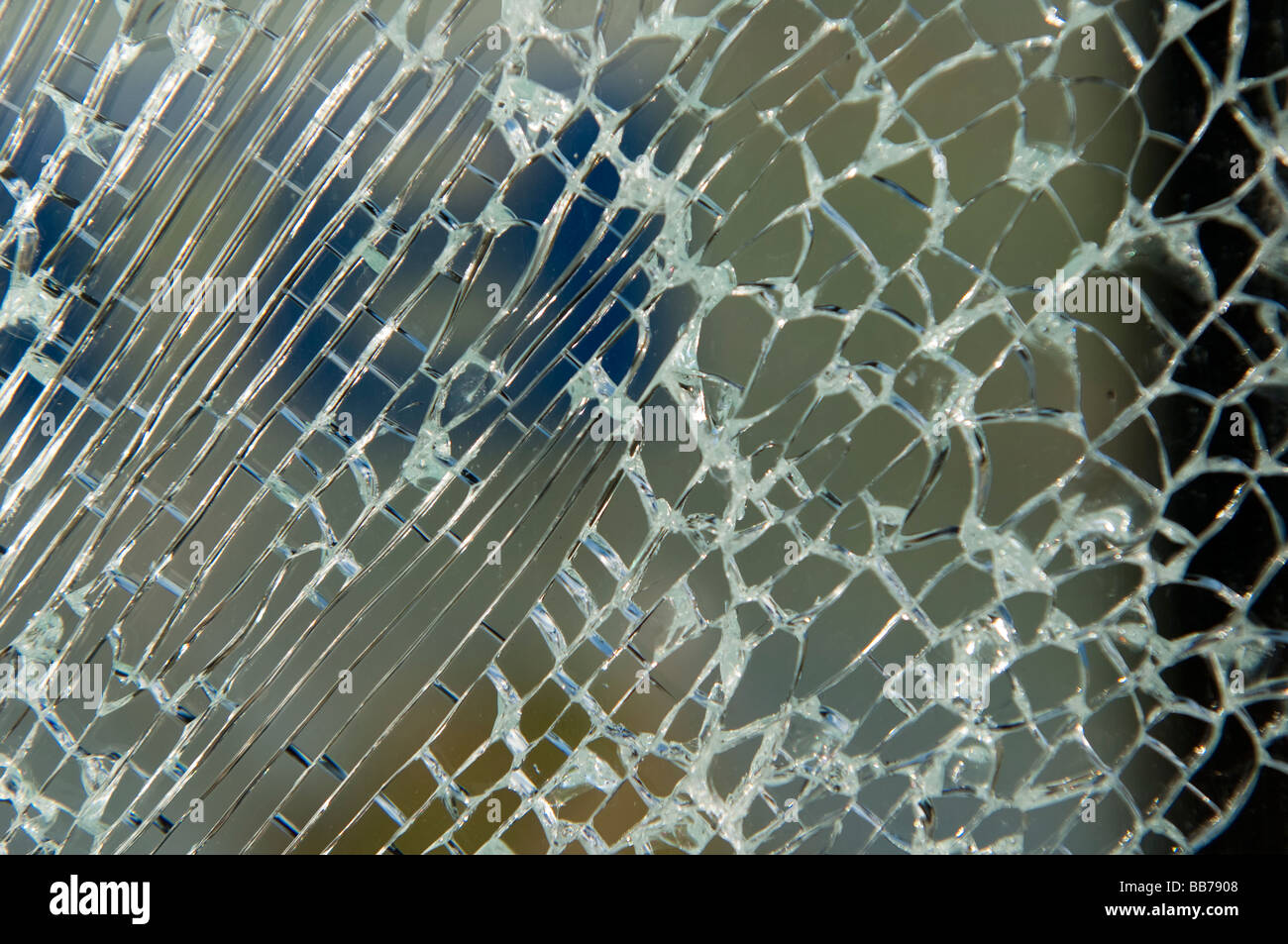 Close up of shattered glass vanadlised telephone box in rural location ...