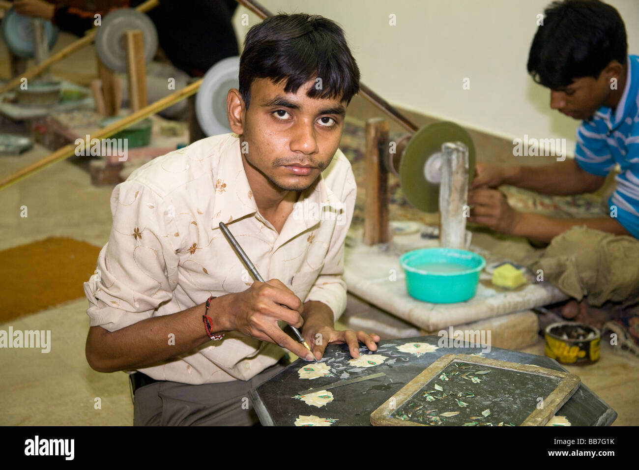Young man inlaying marble into a table top, Marble Art Palace, Agra ...