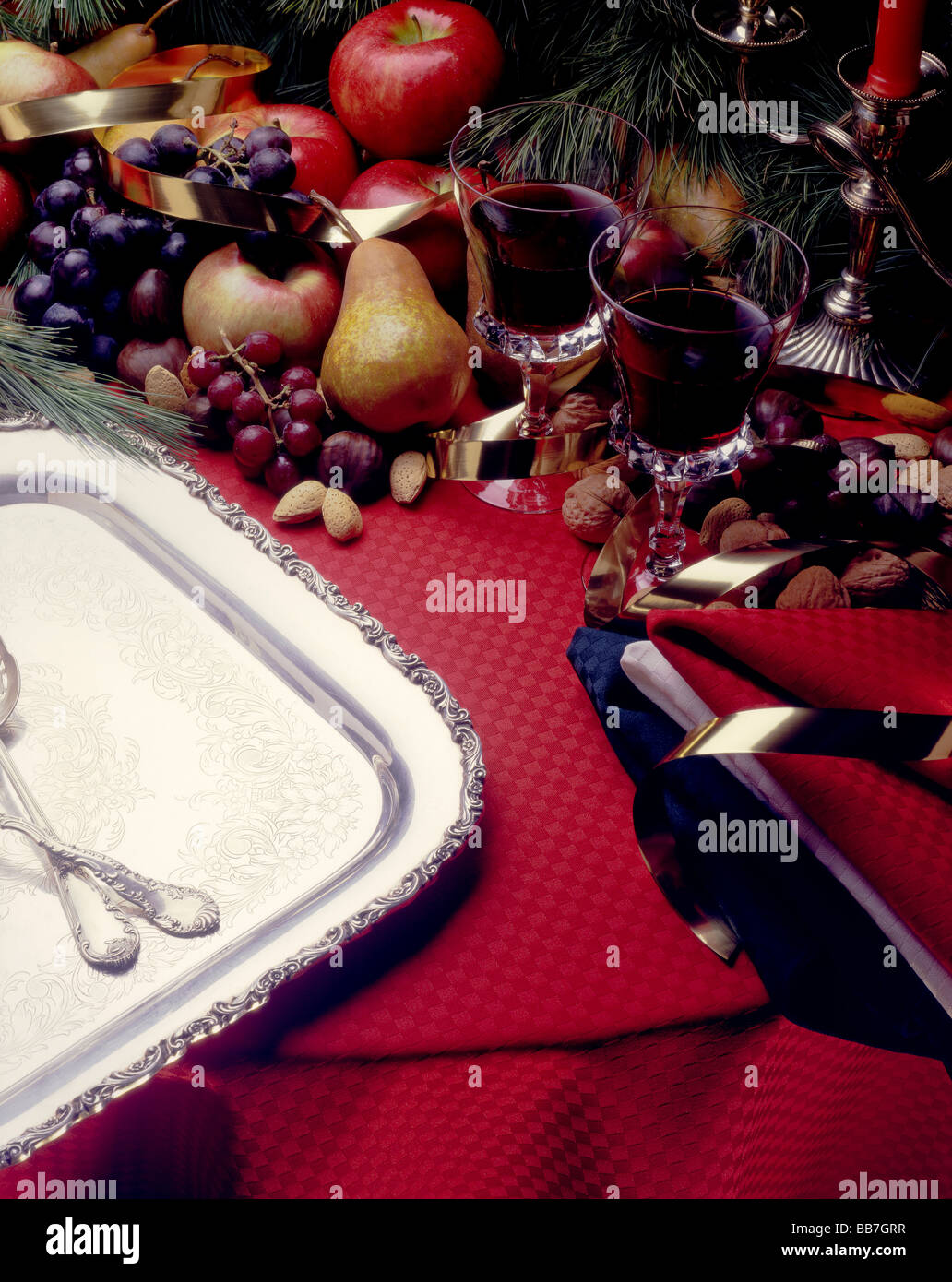 A holiday feast table setting with a Christmas theme Stock Photo - Alamy