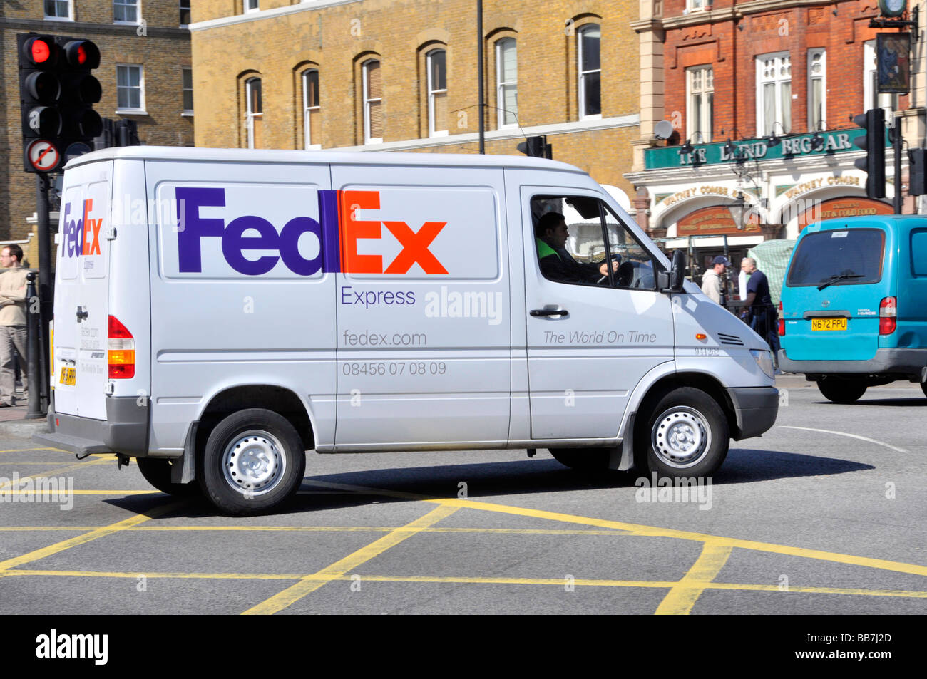 FedEx parcels delivery van at road junction Stock Photo - Alamy