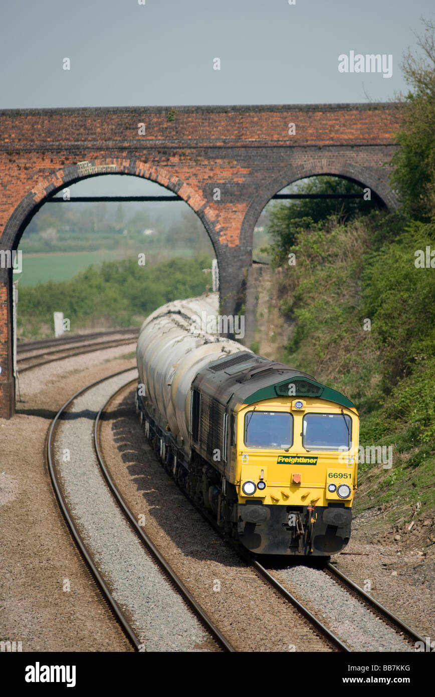 Class 66 diesel locomotive hauling a freight train in Freightliner ...