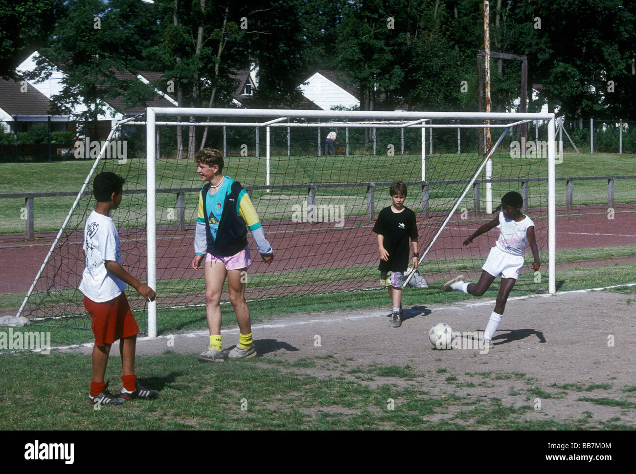 French students, gym class, playing soccer, soccer player, soccer ...