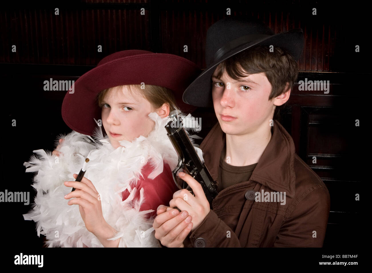 Two teenager kids playing cool mafia gangsters Stock Photo - Alamy
