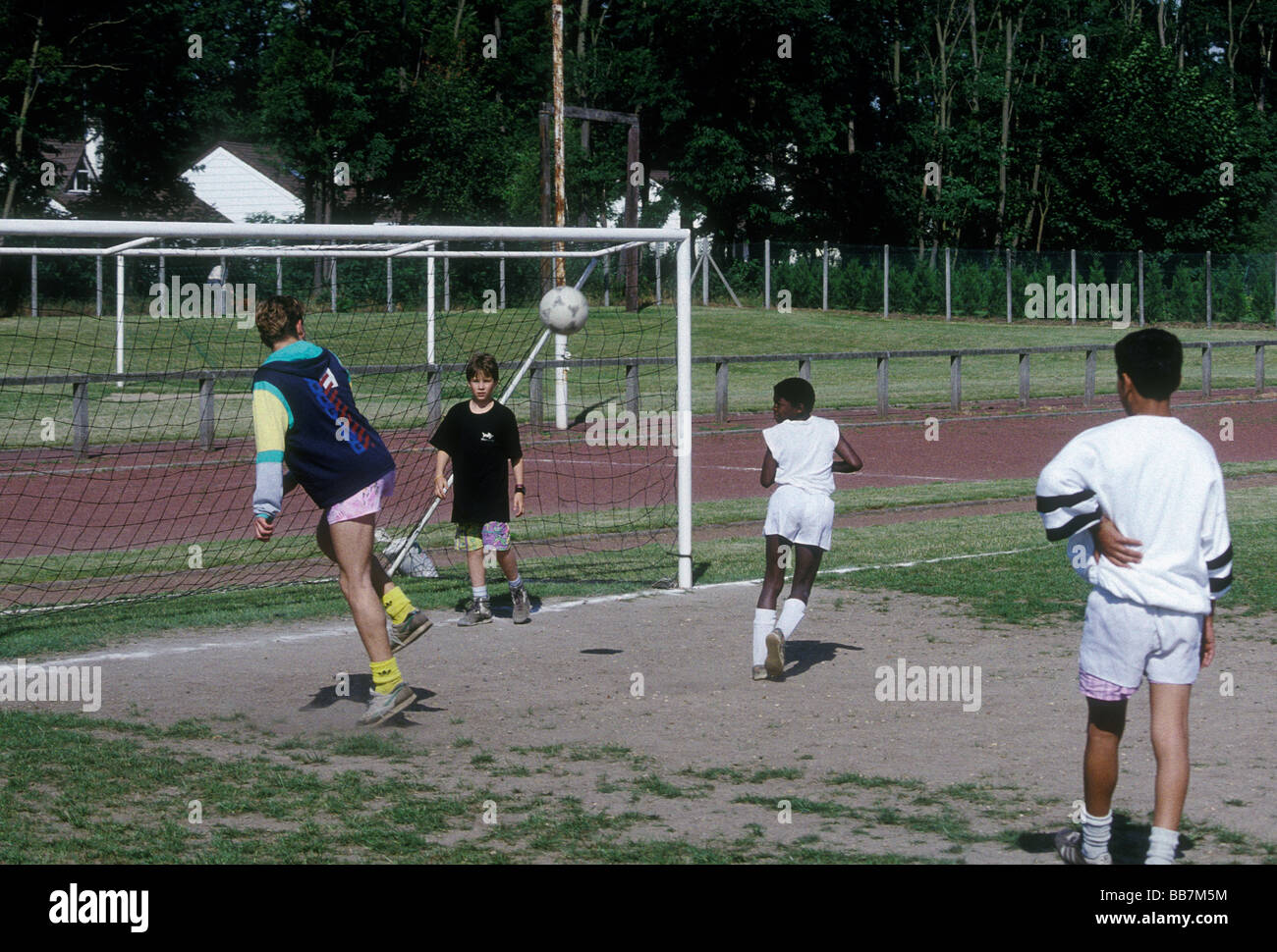 French students, gym class, playing soccer, soccer player, soccer ...