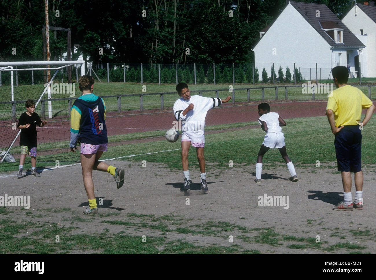 French students, gym class, playing soccer, soccer player, soccer ...