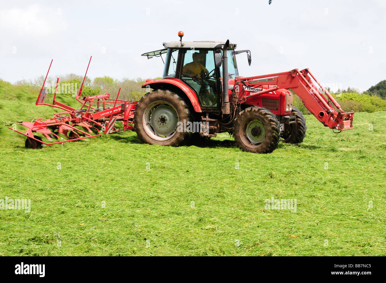 Tractor and silage tedding machine Bosherston Pwmbrokeshire Wales Cymru ...