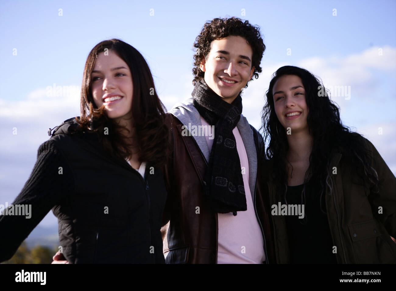 three teenager smiling outside Stock Photo - Alamy
